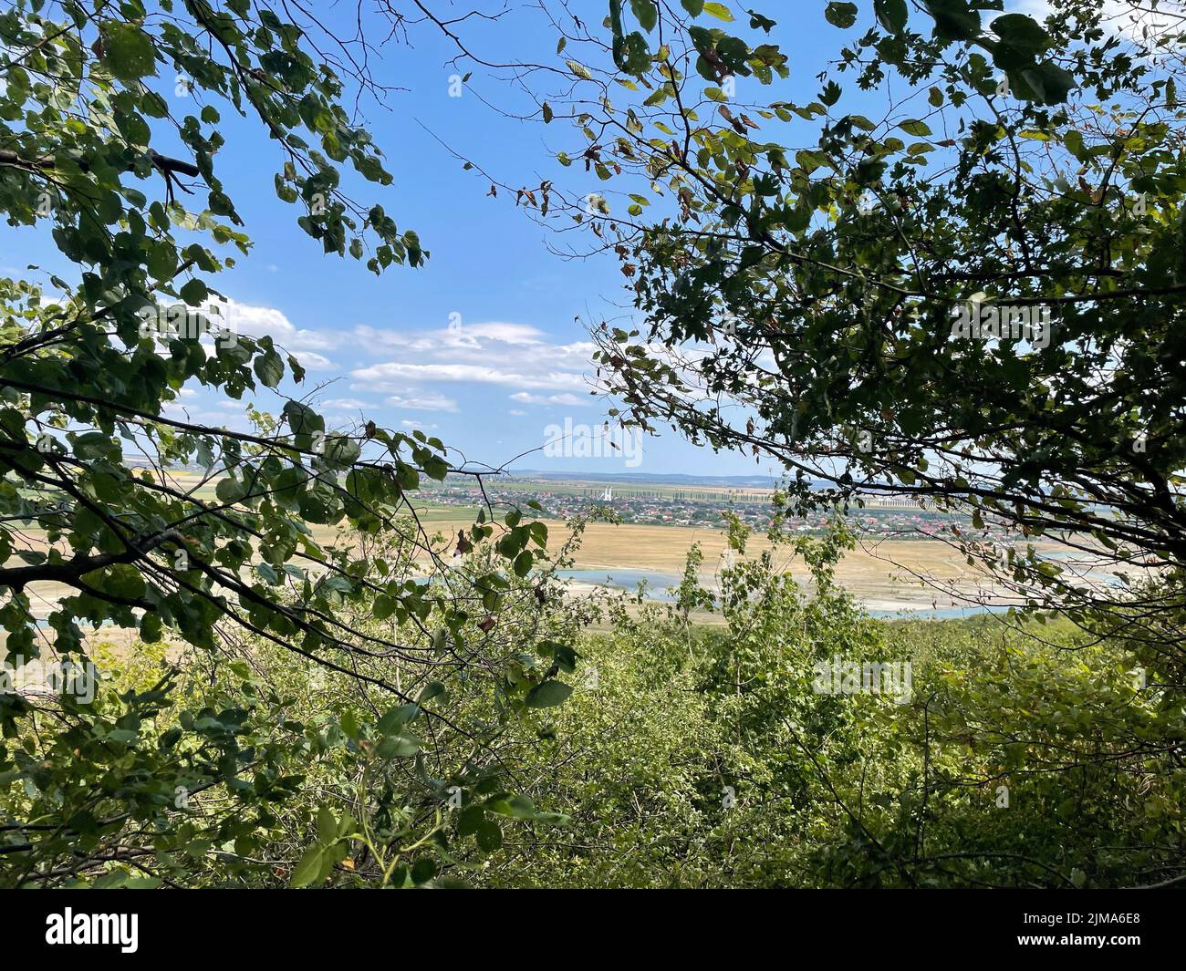 An aerial view of a river flowing through Neamt County, Romania seen ...