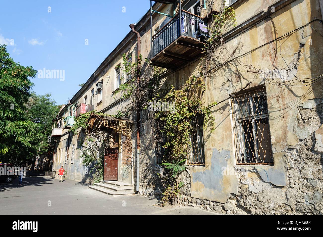 Old residential building with crumbling plaster Stock Photo - Alamy