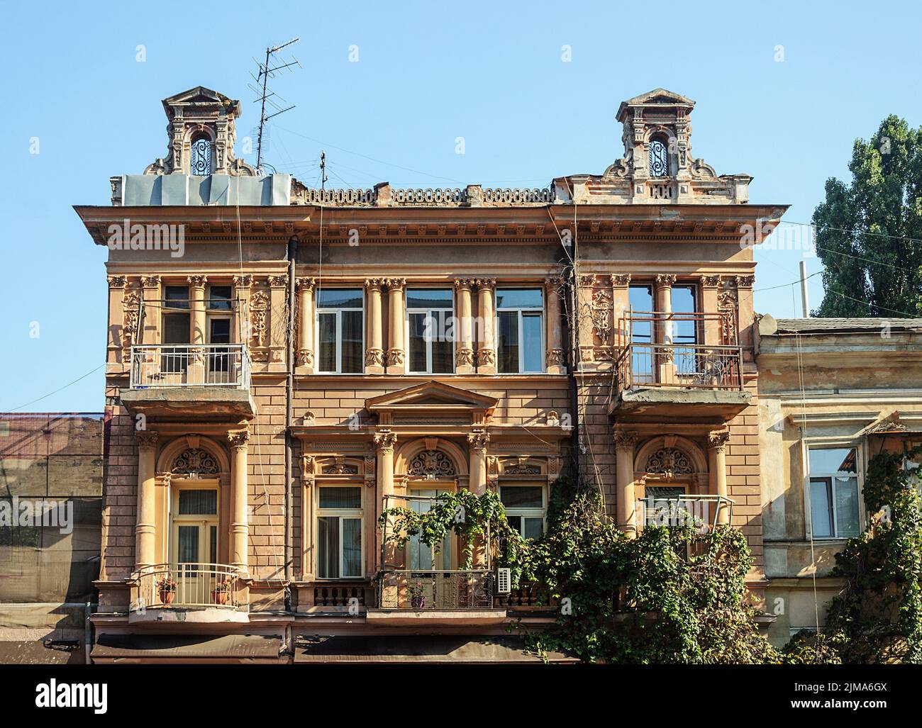 Old mansion, decorated with columns and bas-reliefs Stock Photo - Alamy