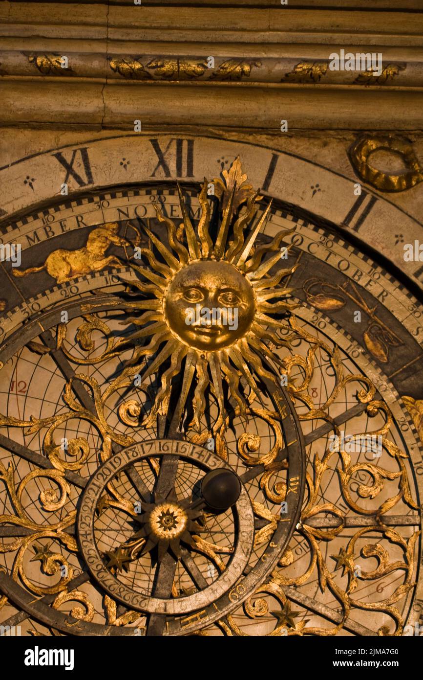 Sun symbol on old clock Stock Photo - Alamy