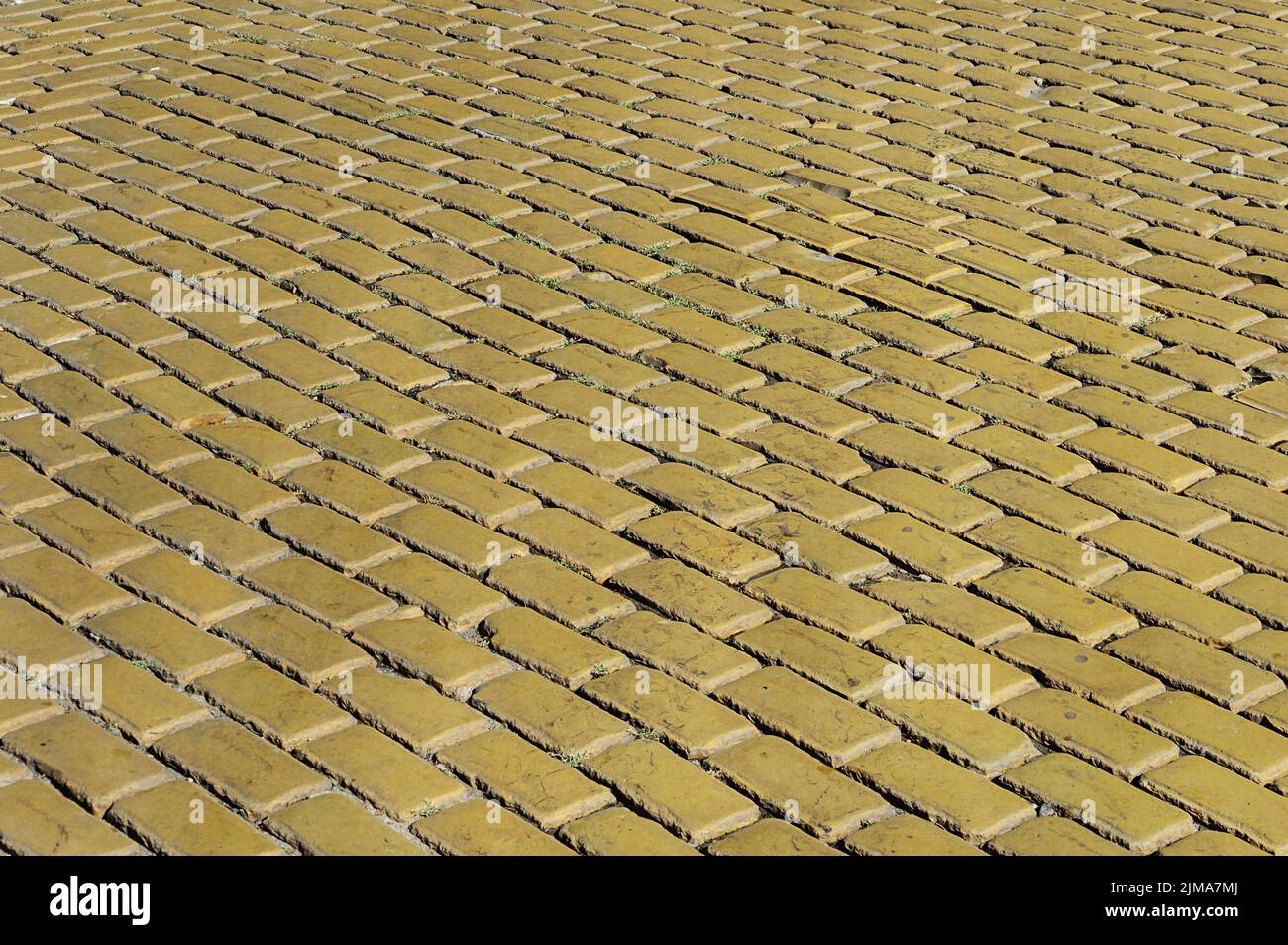 Yellow tiled road surface Stock Photo - Alamy