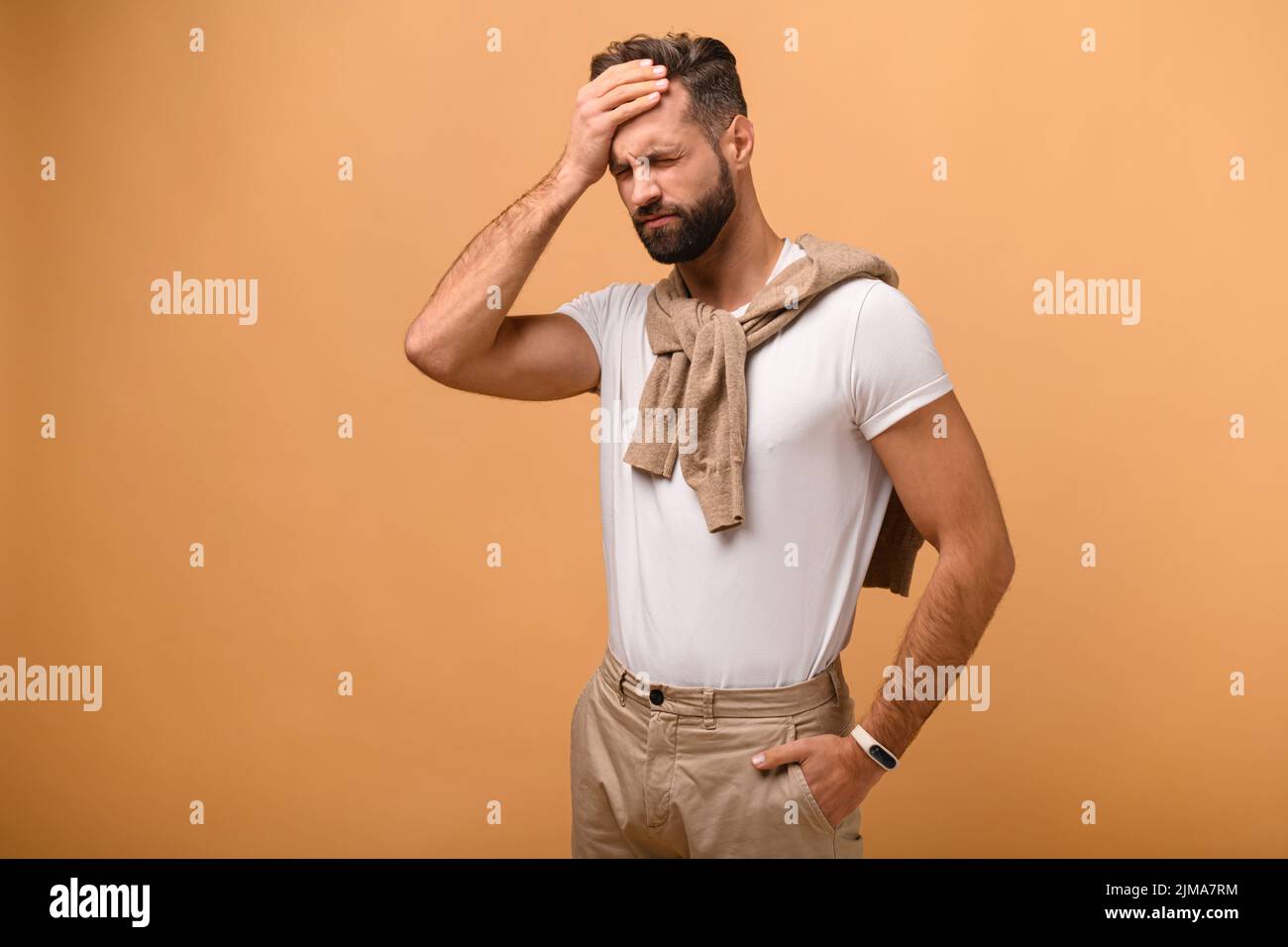 Facepalm. Portrait of regretful man holding hand on face, feeling ...