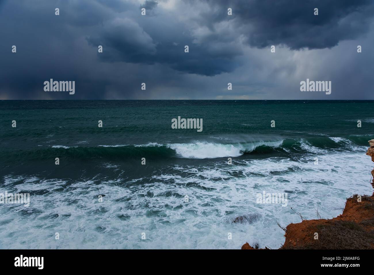 Storm clouds over the sea are black and blue. A hurricane is coming, a ...