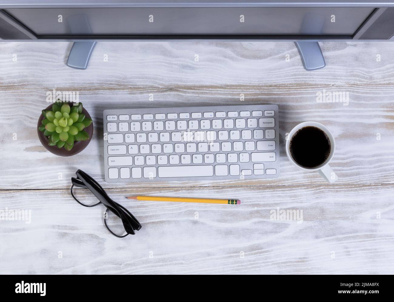 Top view of a desktop setup for work on rustic white wood Stock Photo ...