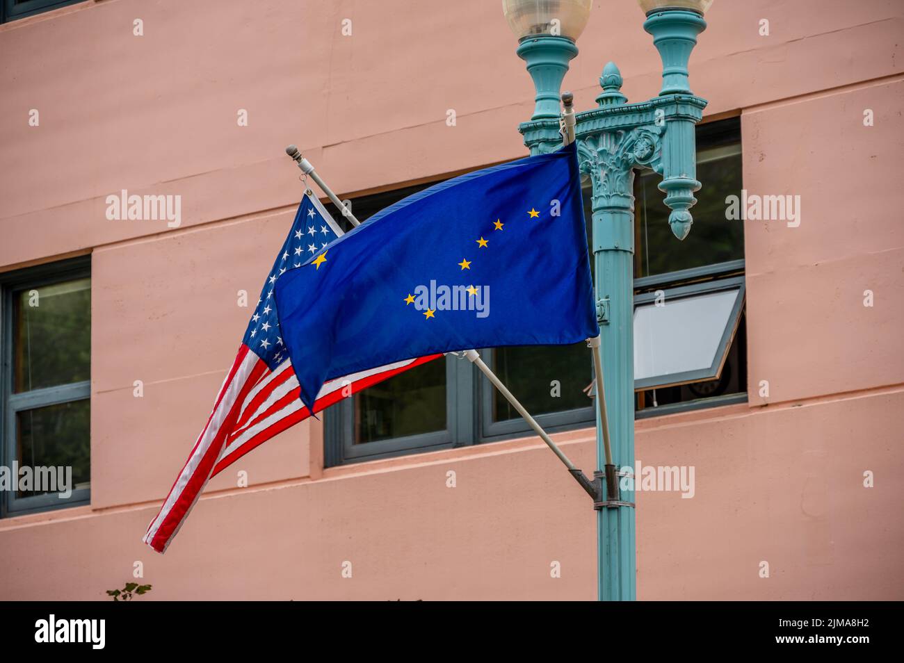 Alsaska an US flags hanging in Ketchikan Stock Photo - Alamy