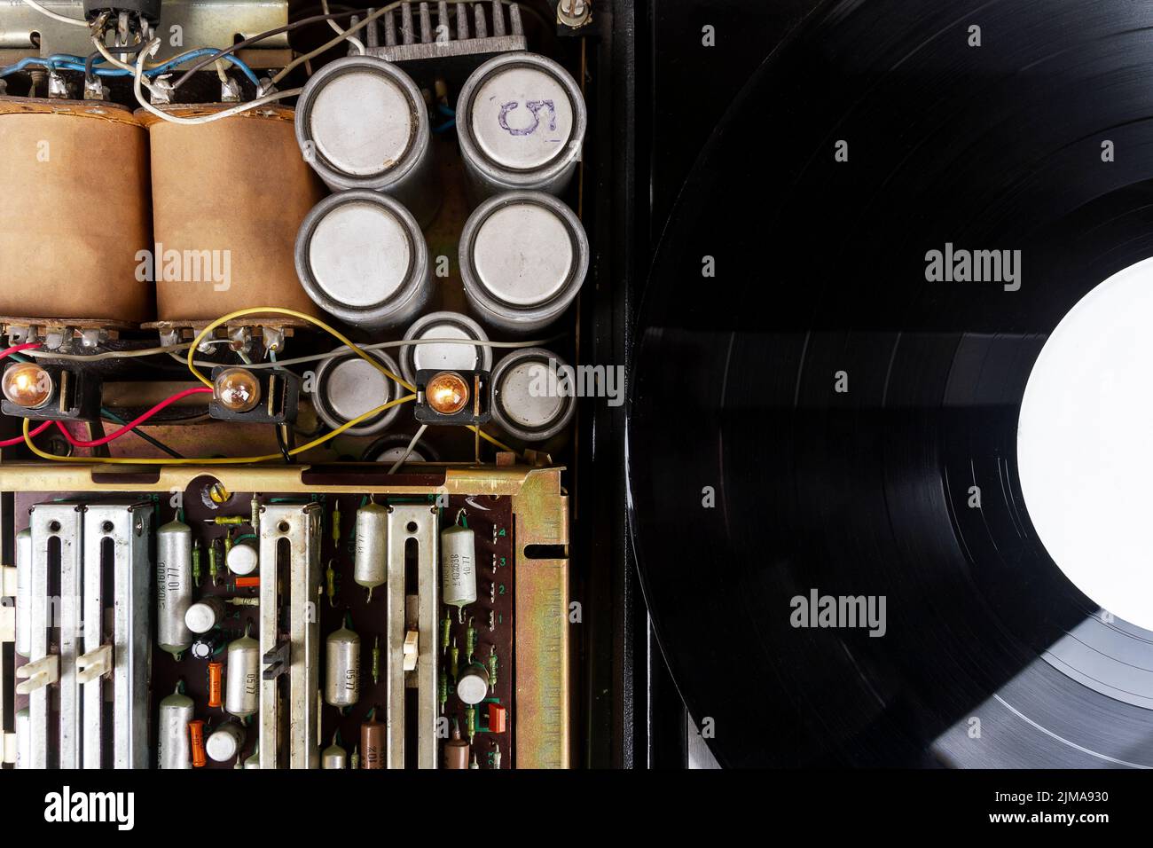 Inside view of turntable with amplifier, capacitors, coils and other ...