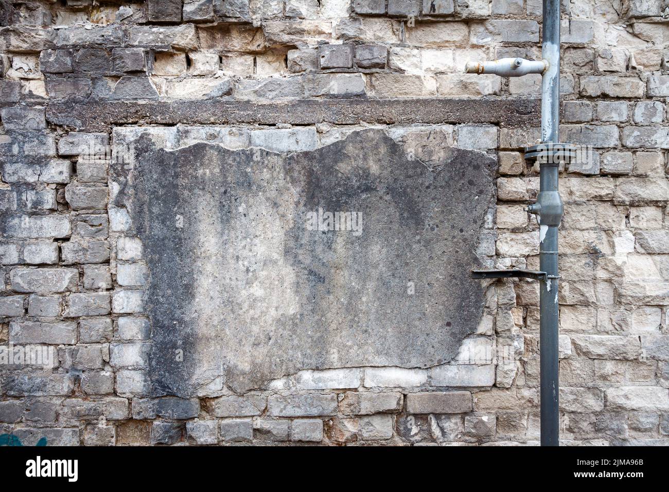 Old gray brick and plaster wall texture background. Painted distressed ...