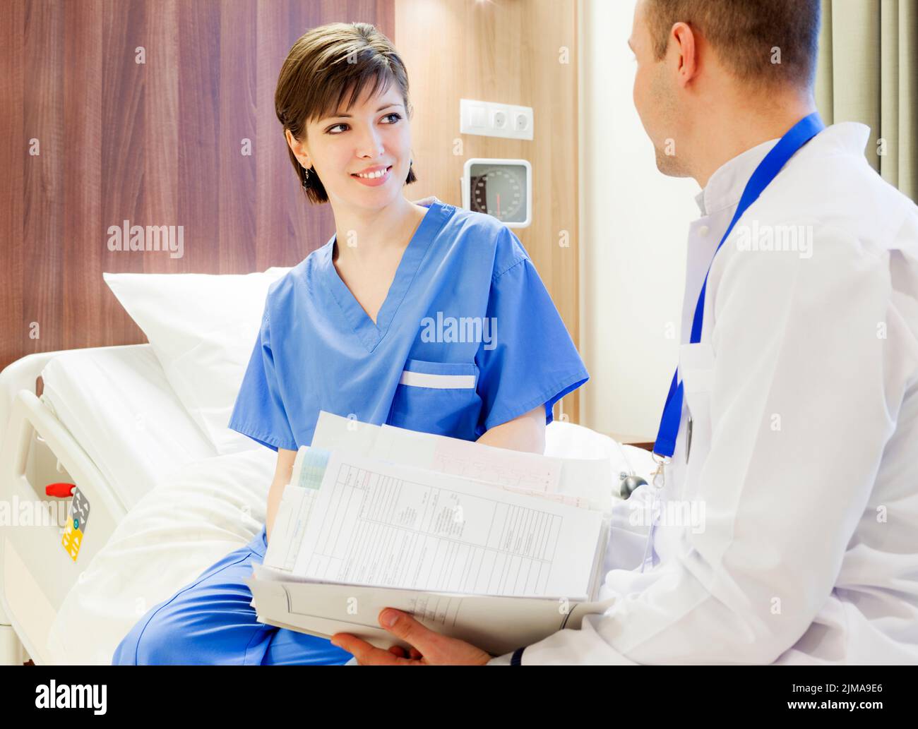 Happy healed patient talking doctor hospital Stock Photo - Alamy