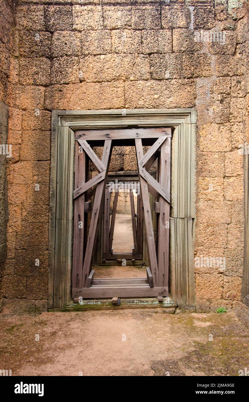 Restoration work on doorway - Angkor Stock Photo - Alamy