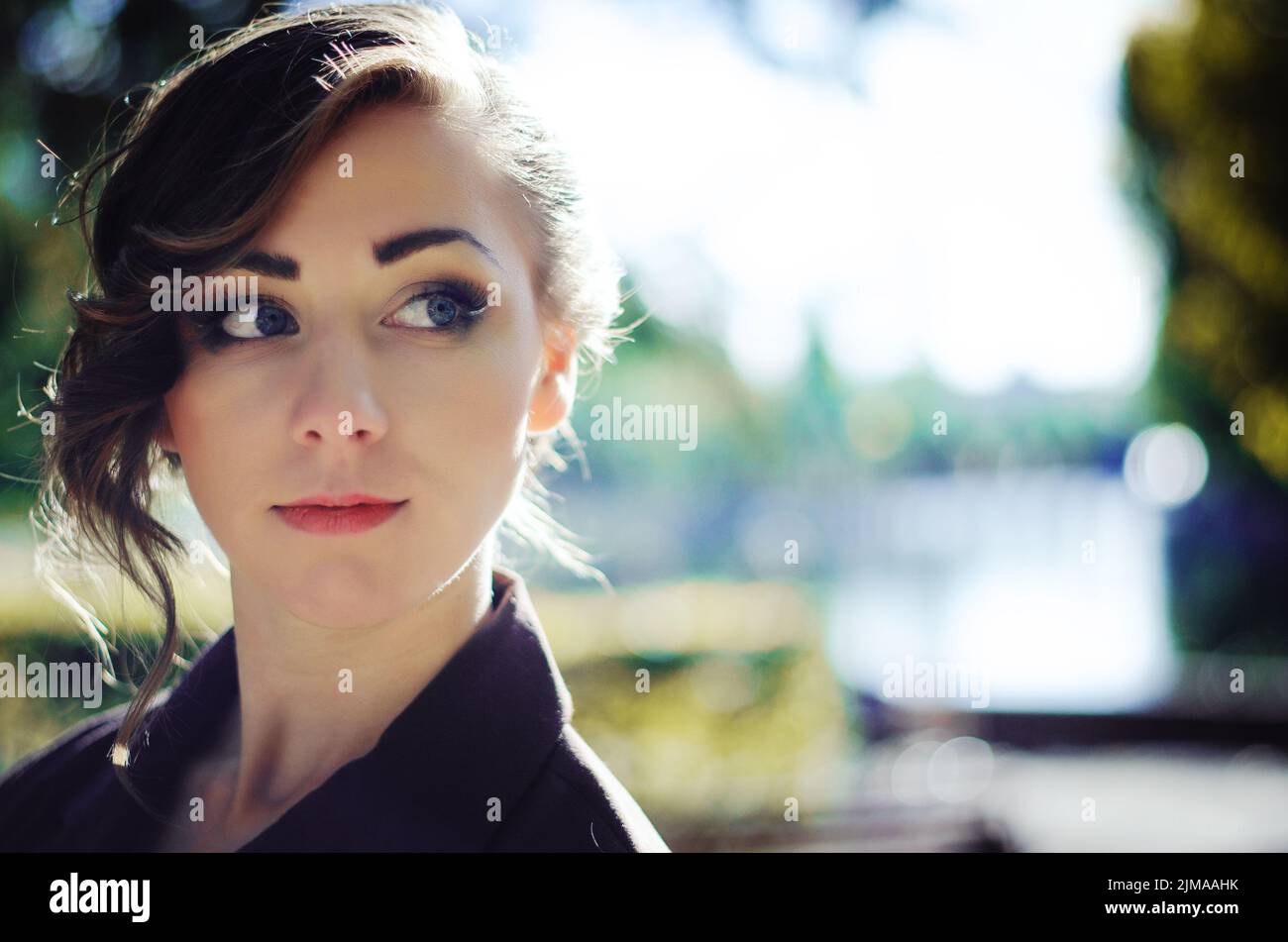 Close up face portrait of smart girl with old-fashioned hairstyle ...