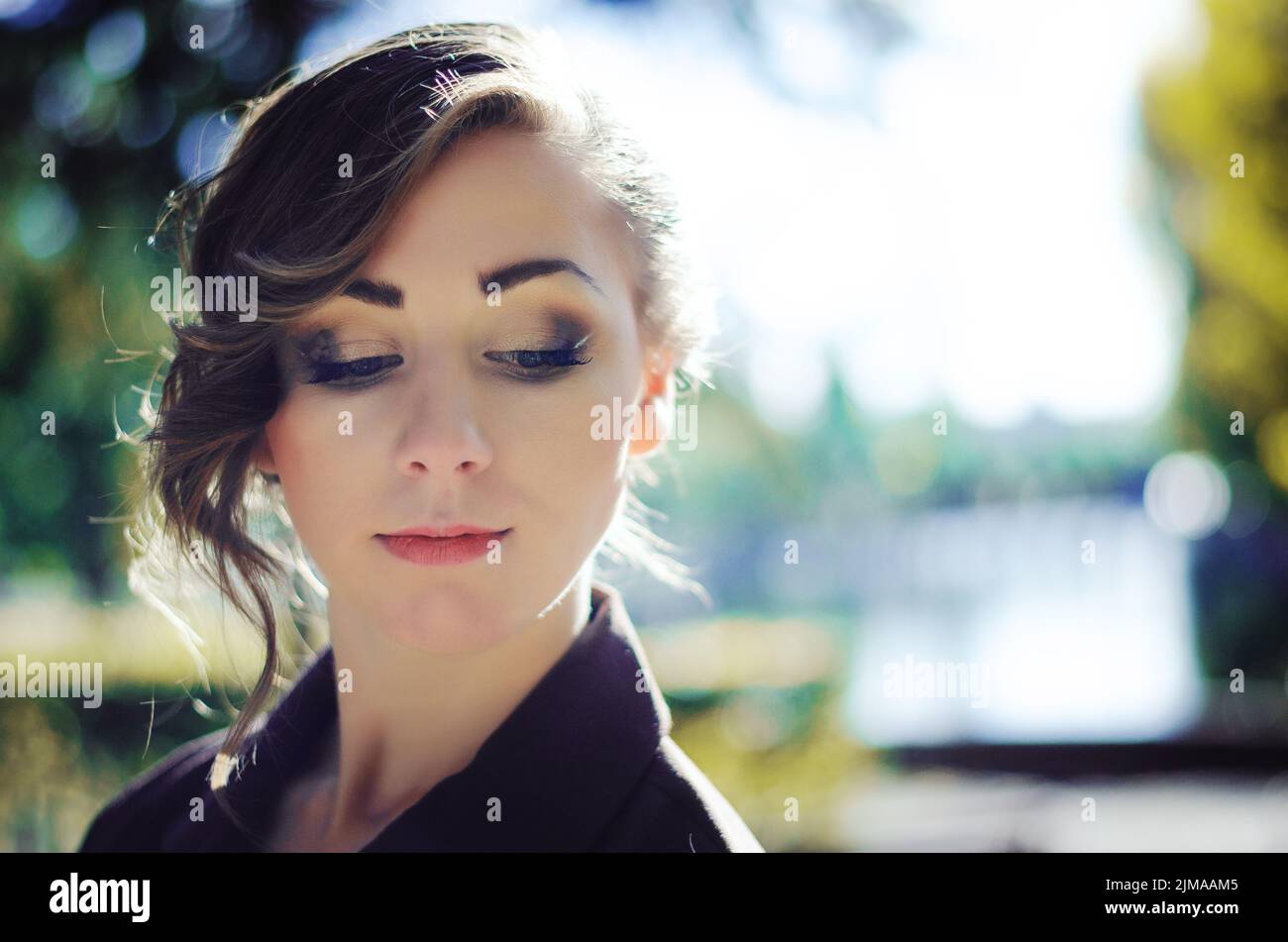 Close up face portrait of smart girl with old-fashioned hairstyle ...