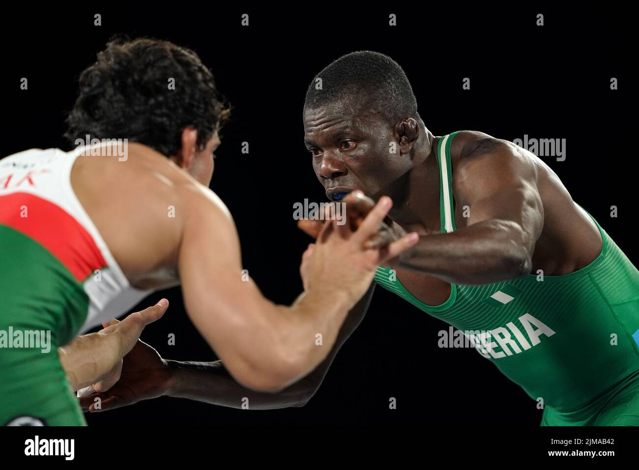 Pakistan's Inayat Ullah grapples with Nigeria's Amas Daniel during the ...