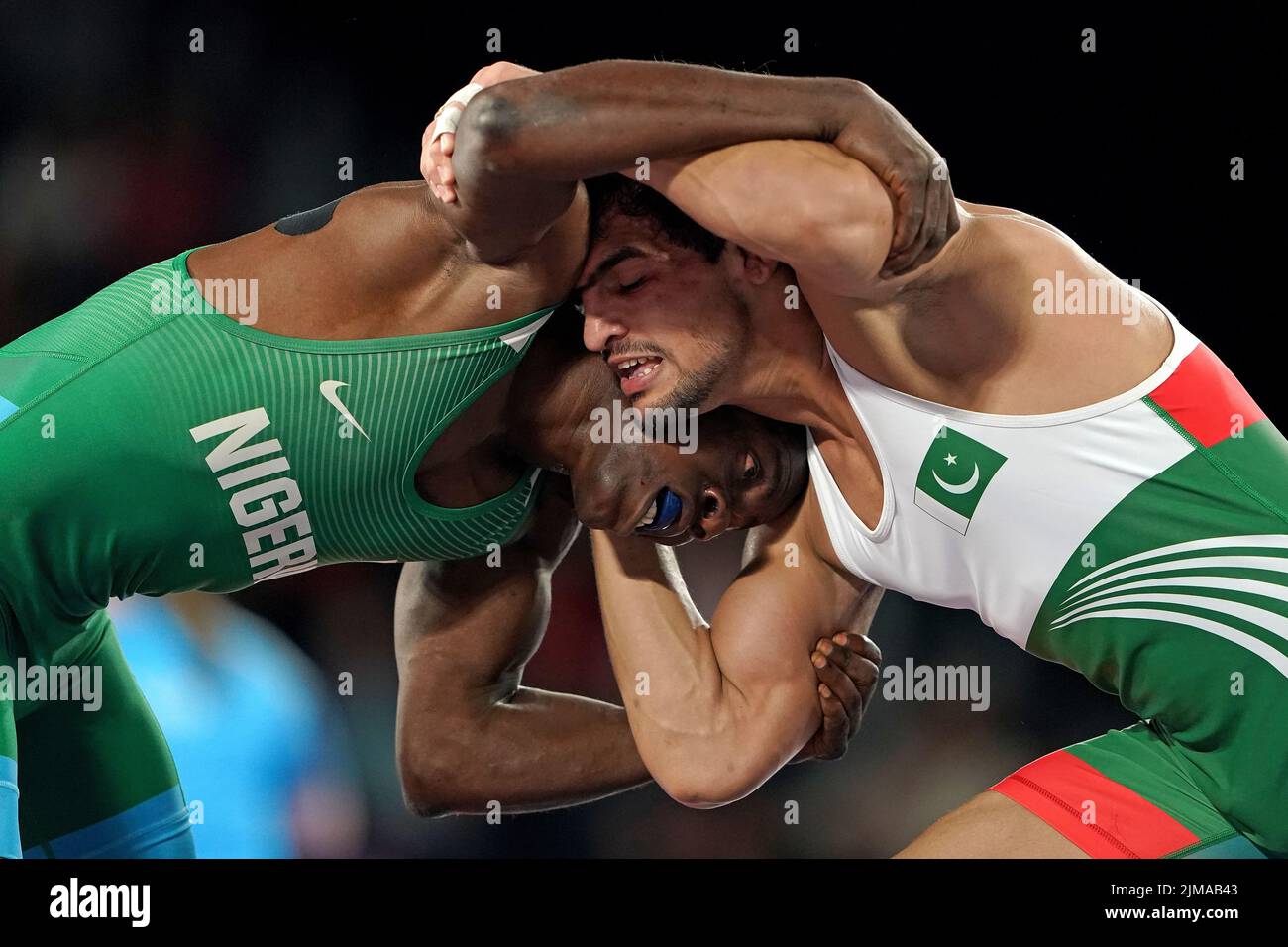 Pakistan's Inayat Ullah grapples with Nigeria's Amas Daniel during the ...