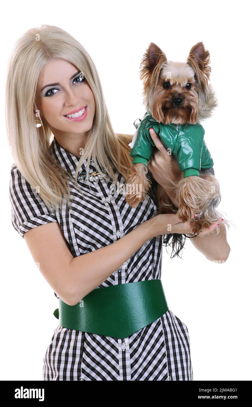 The young beautiful fashionable blonde girl with a cute little dog ...