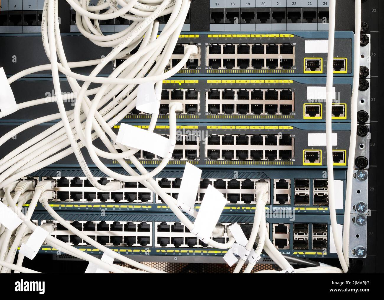 Rack mounted network equipment with cross patch-cords Stock Photo - Alamy