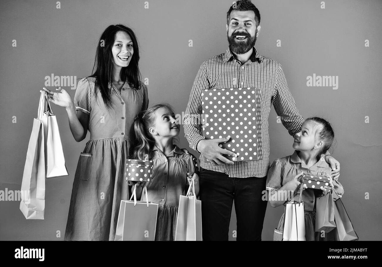 happy family go shopping together hold packages, shop Stock Photo - Alamy