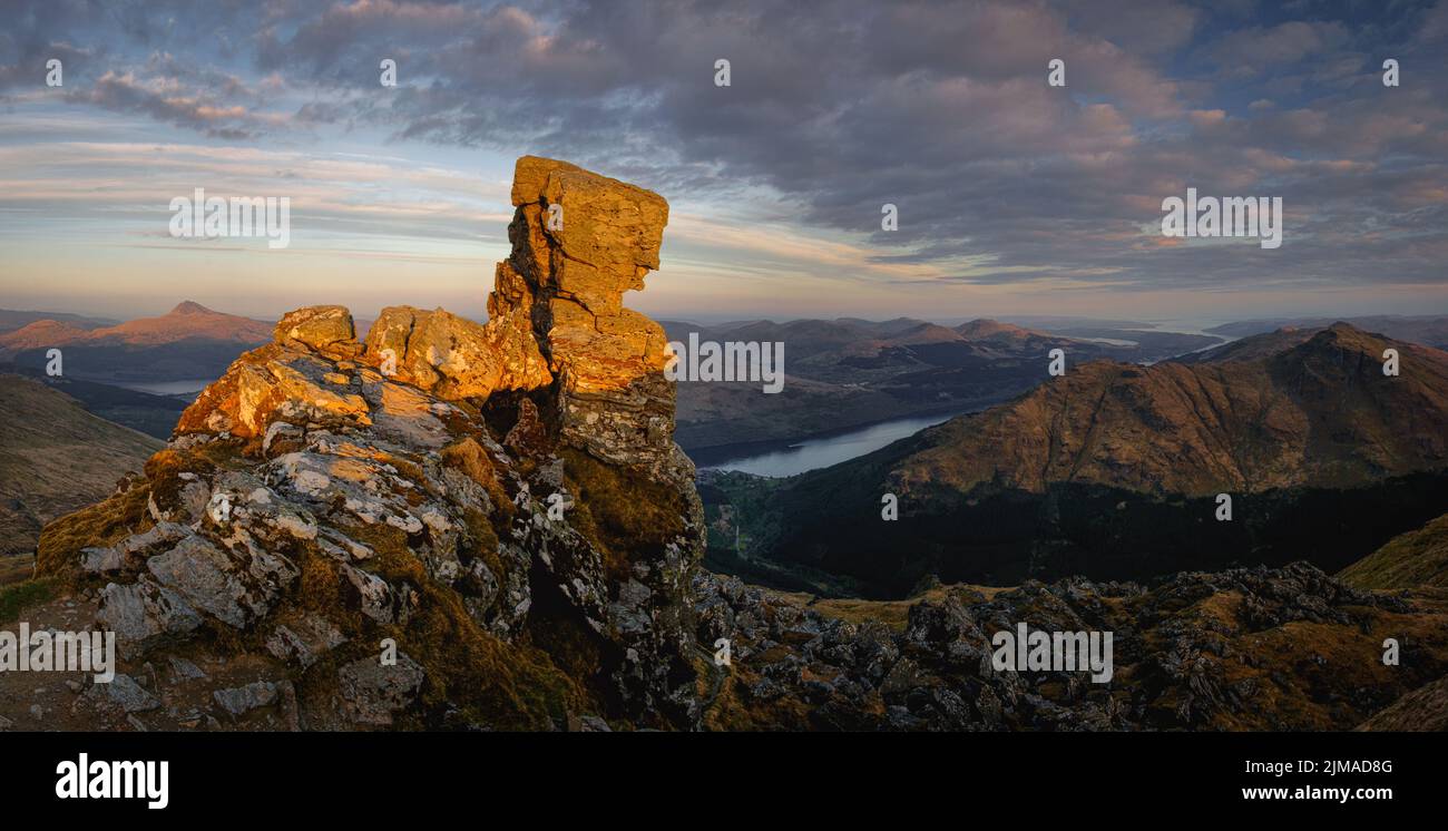 The rocky summit of Ben Arthur, also known as The Cobbler, captured at sunset in the Loch Lomond ...