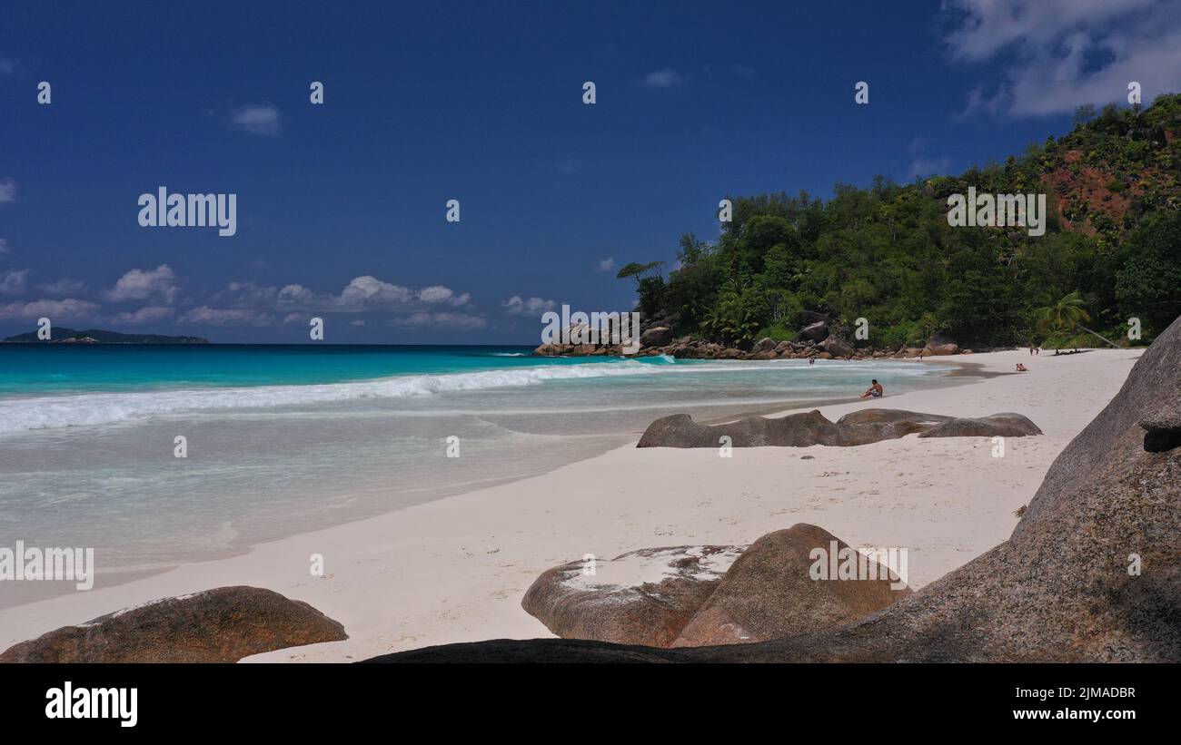 The soft ocean waves with foam on the beach Stock Photo - Alamy
