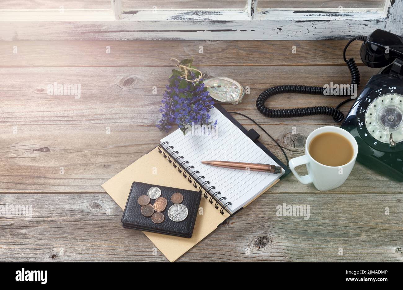 Antique desktop objects and nature decorations with bright hazy light ...