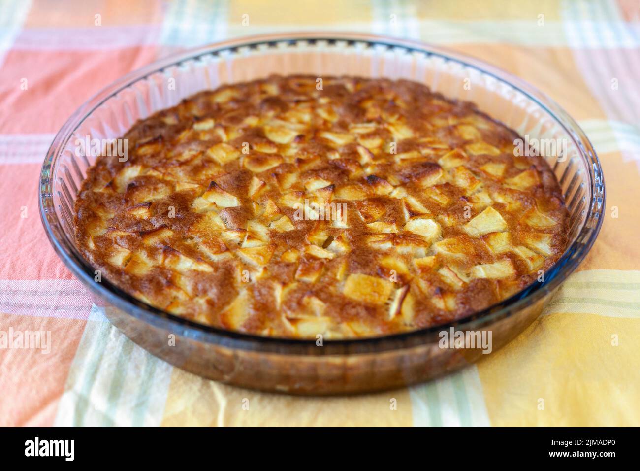 apple pie in a glass mold on a yellow napkin, side view Stock Photo - Alamy