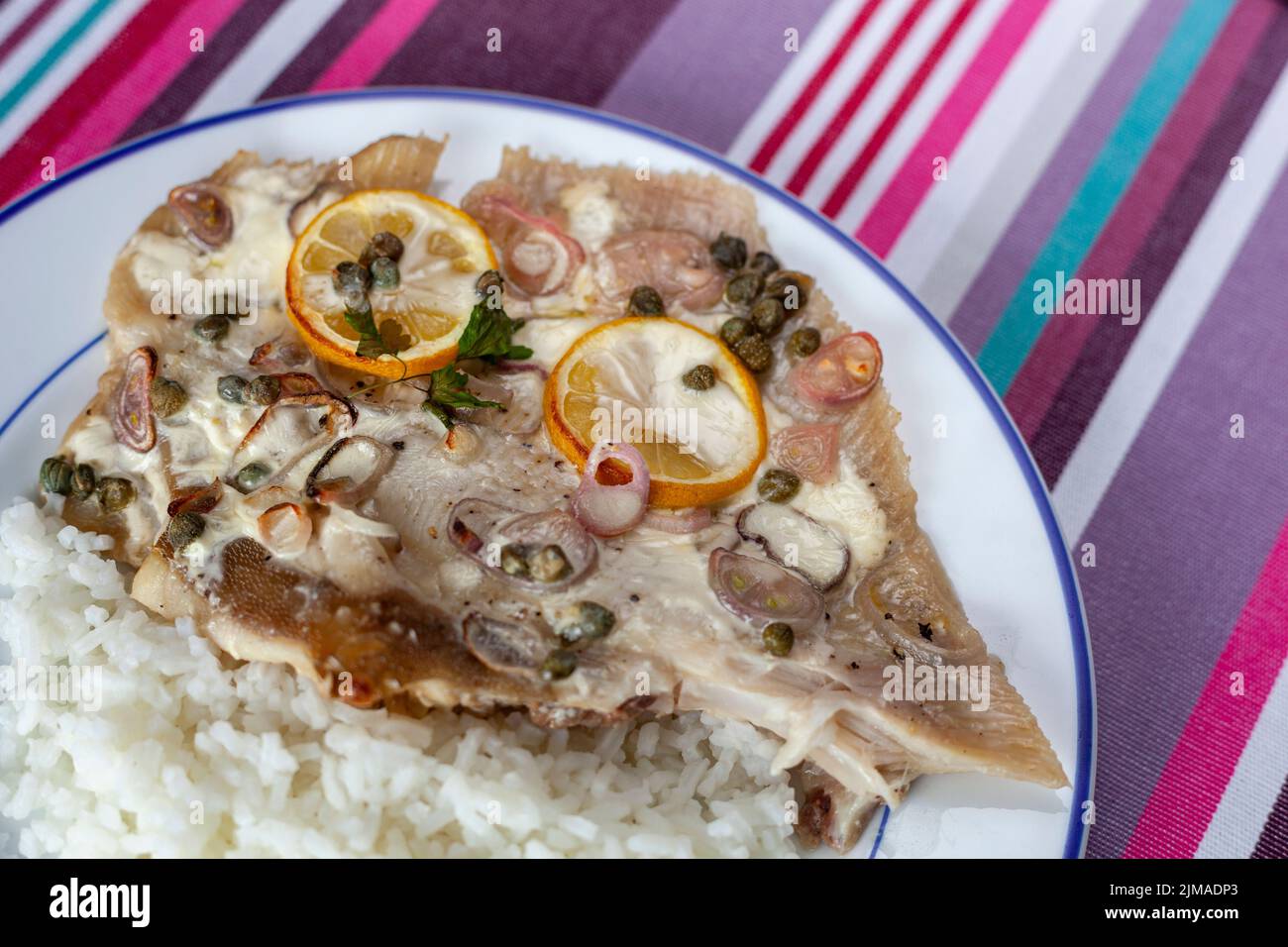 ray fish wings prepared with capers, shallot and lemons and served with ...