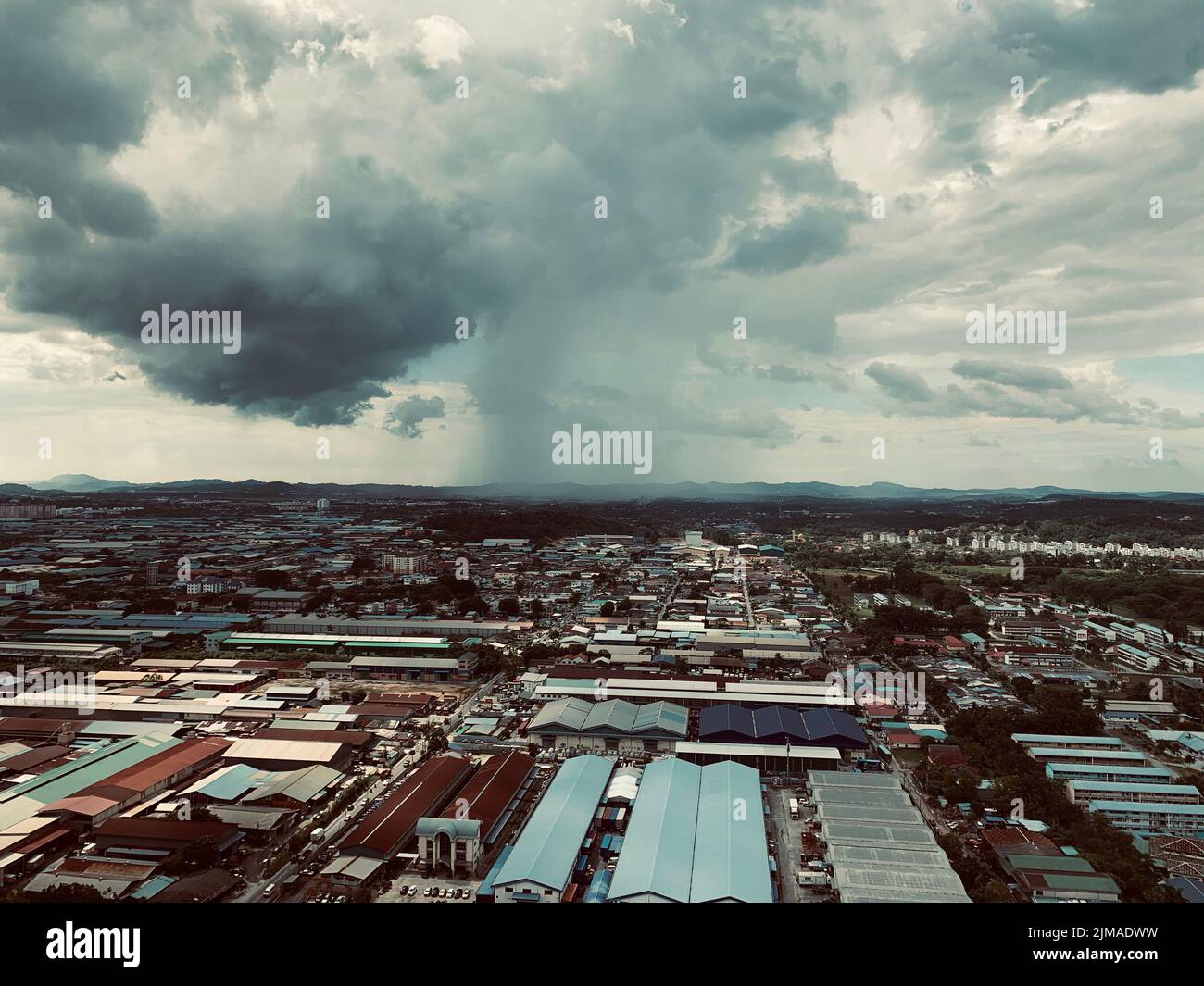 The aerial view of an urban city buildings roofs and streets on a ...