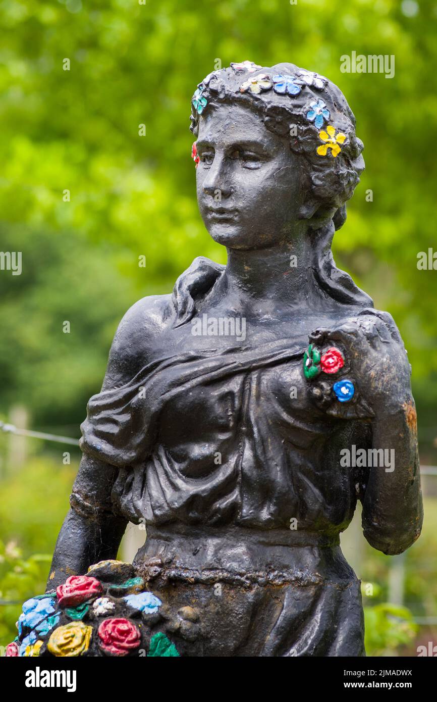 Woman flower leaves hi-res stock photography and images - Alamy