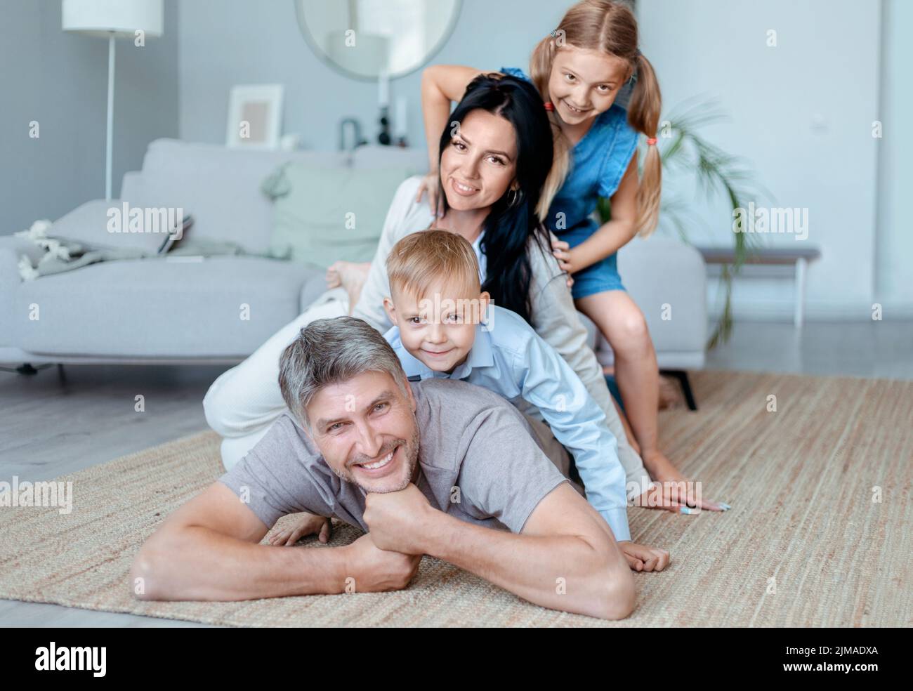 portrait of a happy family with two children Stock Photo - Alamy