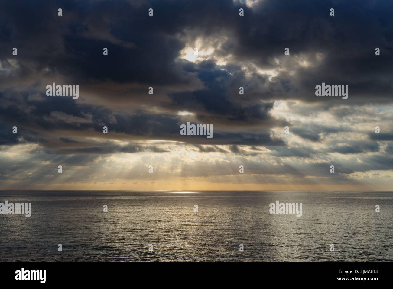 Dark cumulus clouds hovering over the sea Stock Photo - Alamy