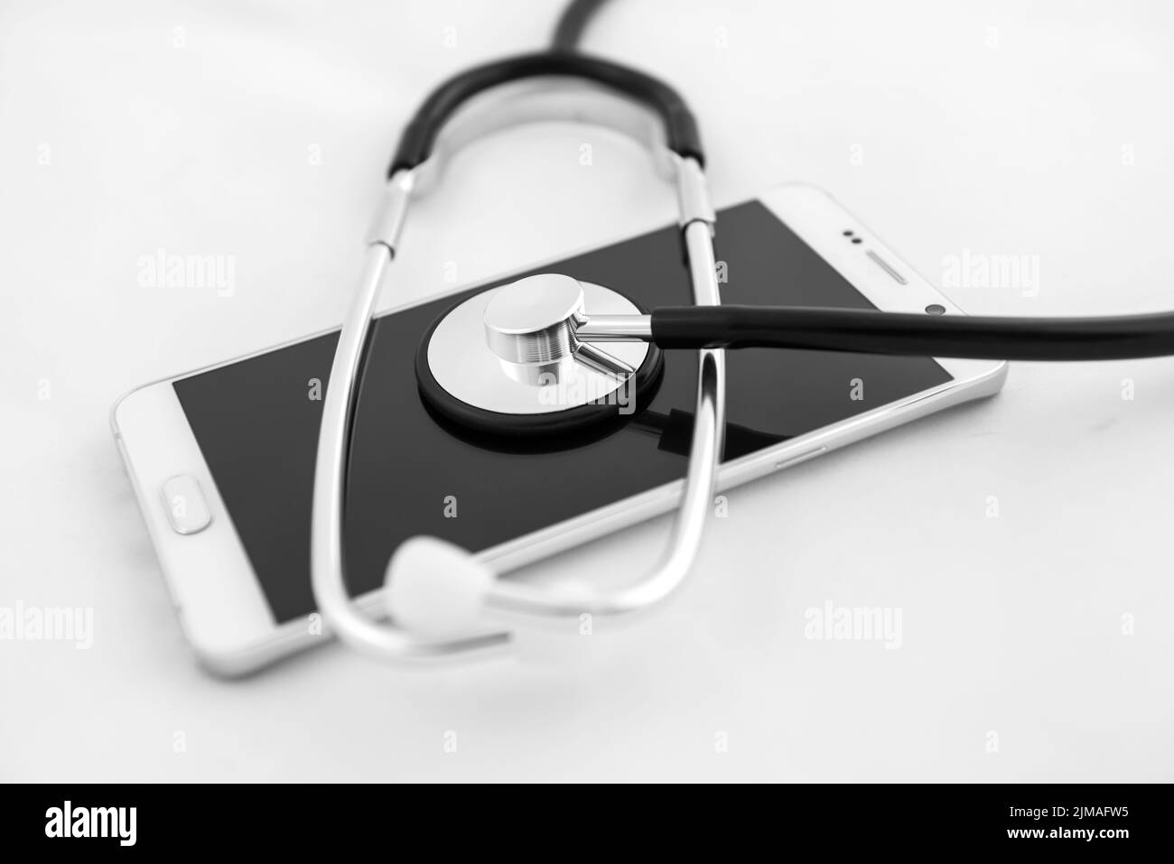 Medical stethoscope tool over the surface of a mobile smart phone Stock ...