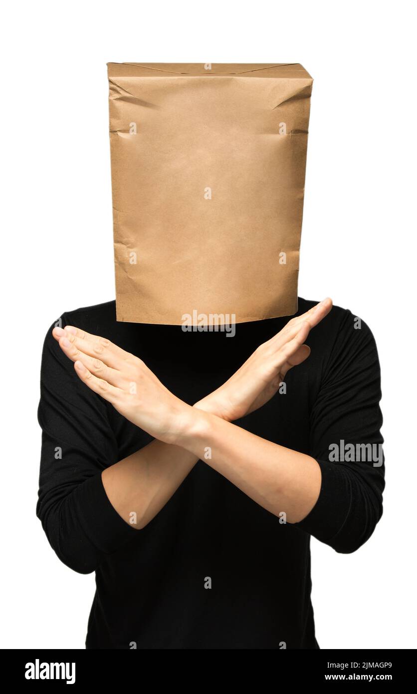 Young man covering his head using a paper bag. arms crossed Stock Photo ...