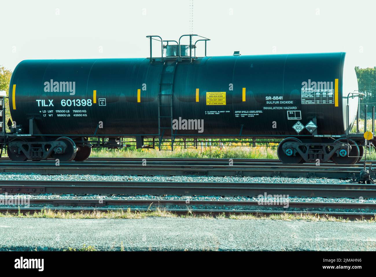 Train tanker sitting in rail yard on an ealy summer morning Stock Photo ...