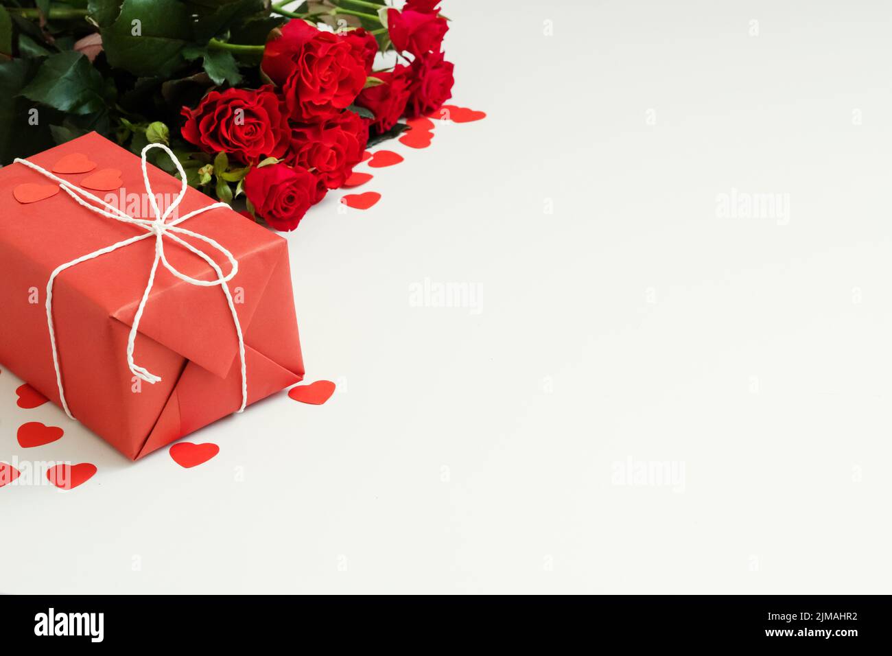 romantic holiday surprise gift box red roses Stock Photo - Alamy