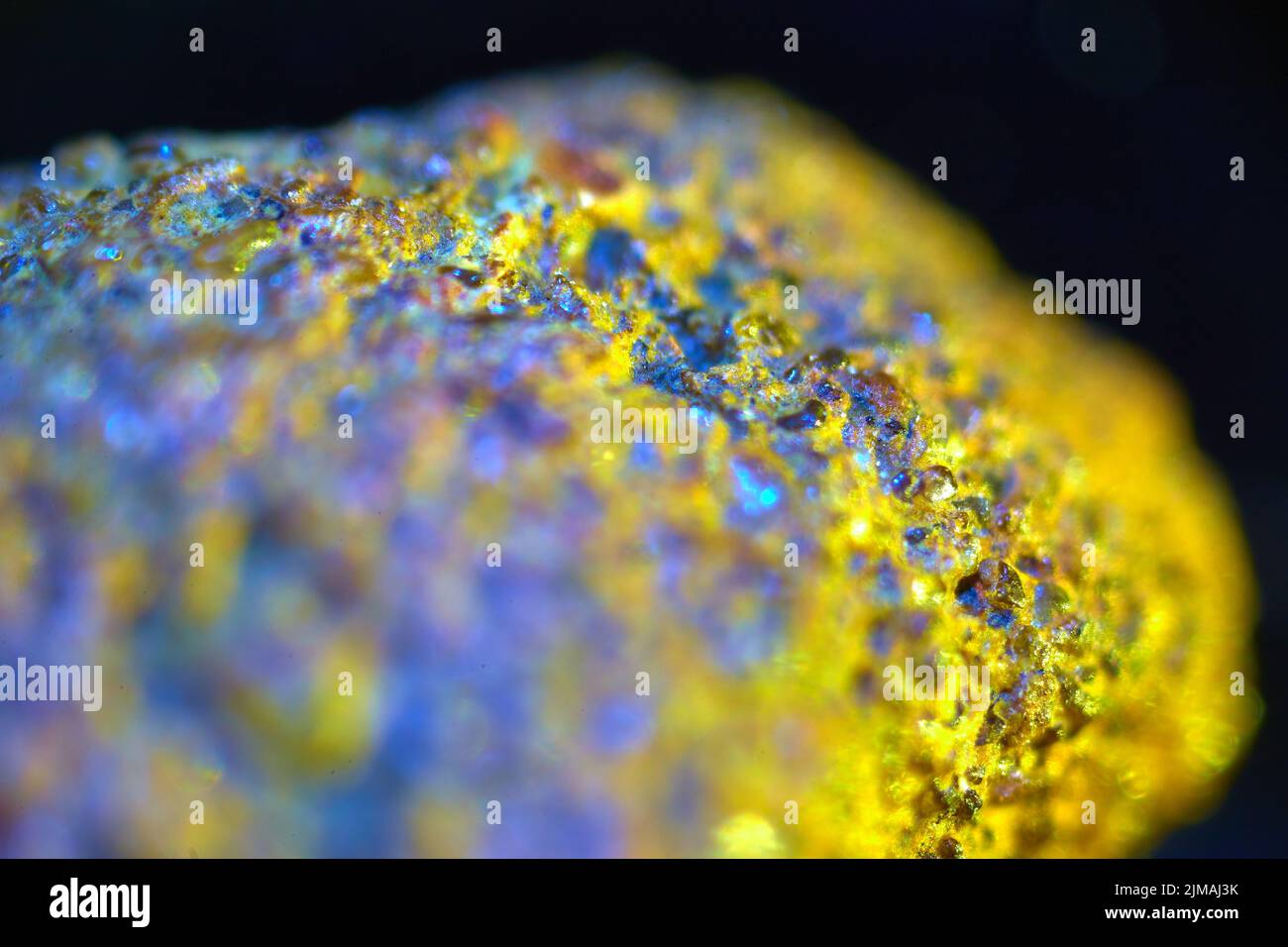stone ore under the microscope colored stone Stock Photo - Alamy