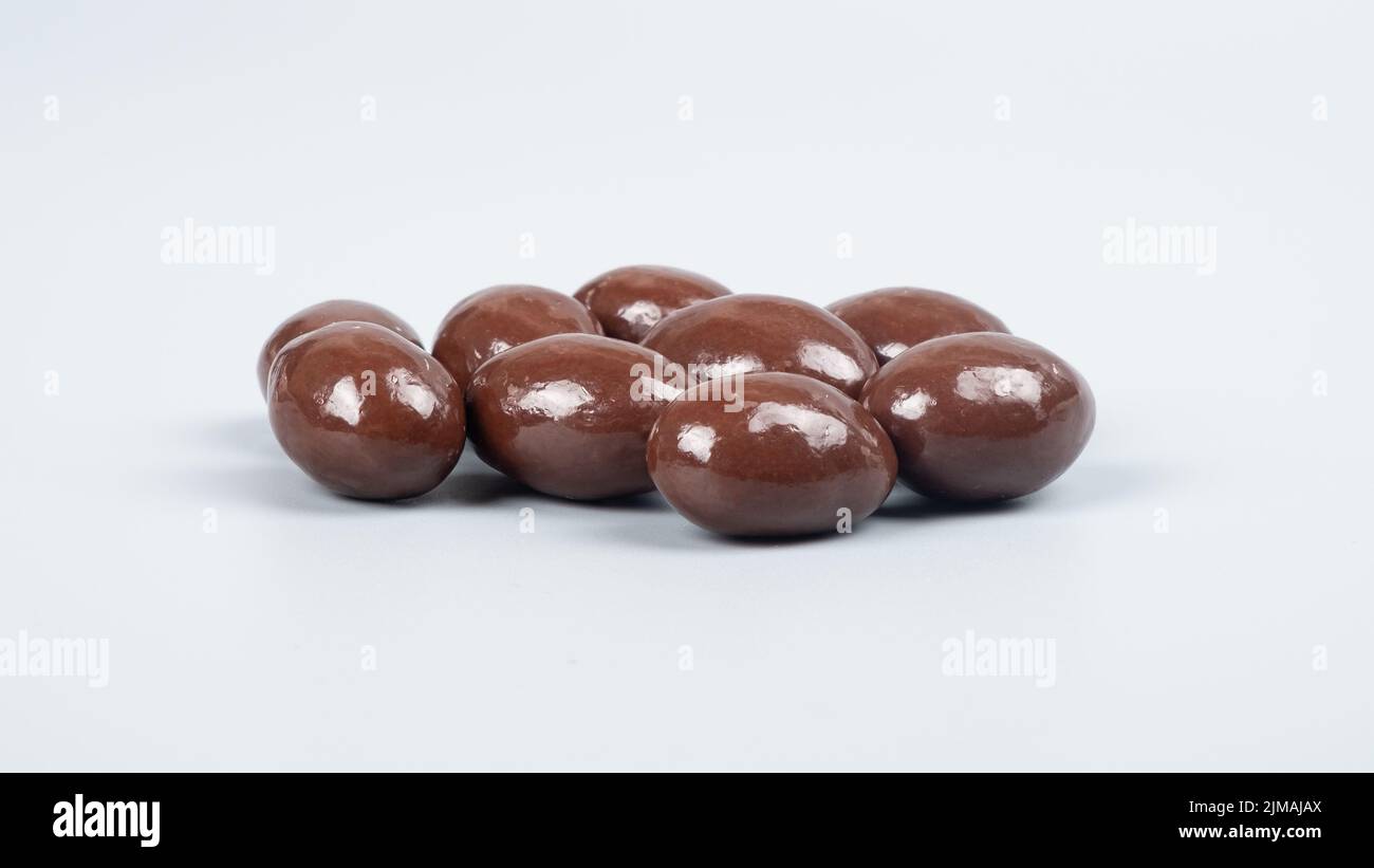 chocolate nuts on gray background, chocolate coated peanuts Stock Photo ...