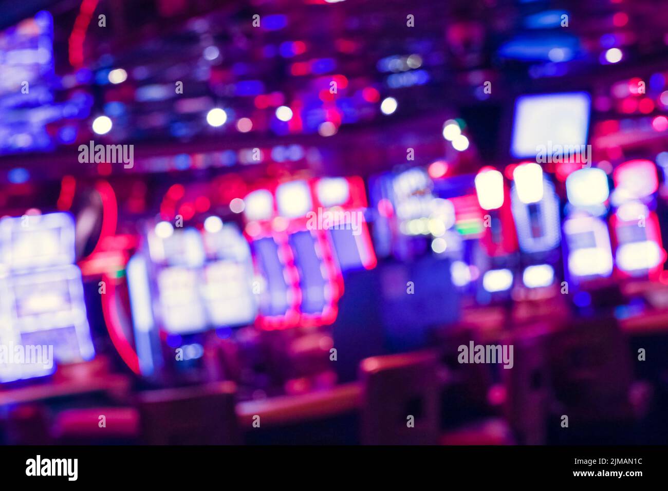 Blurry image of slots machines at the Casino Stock Photo - Alamy