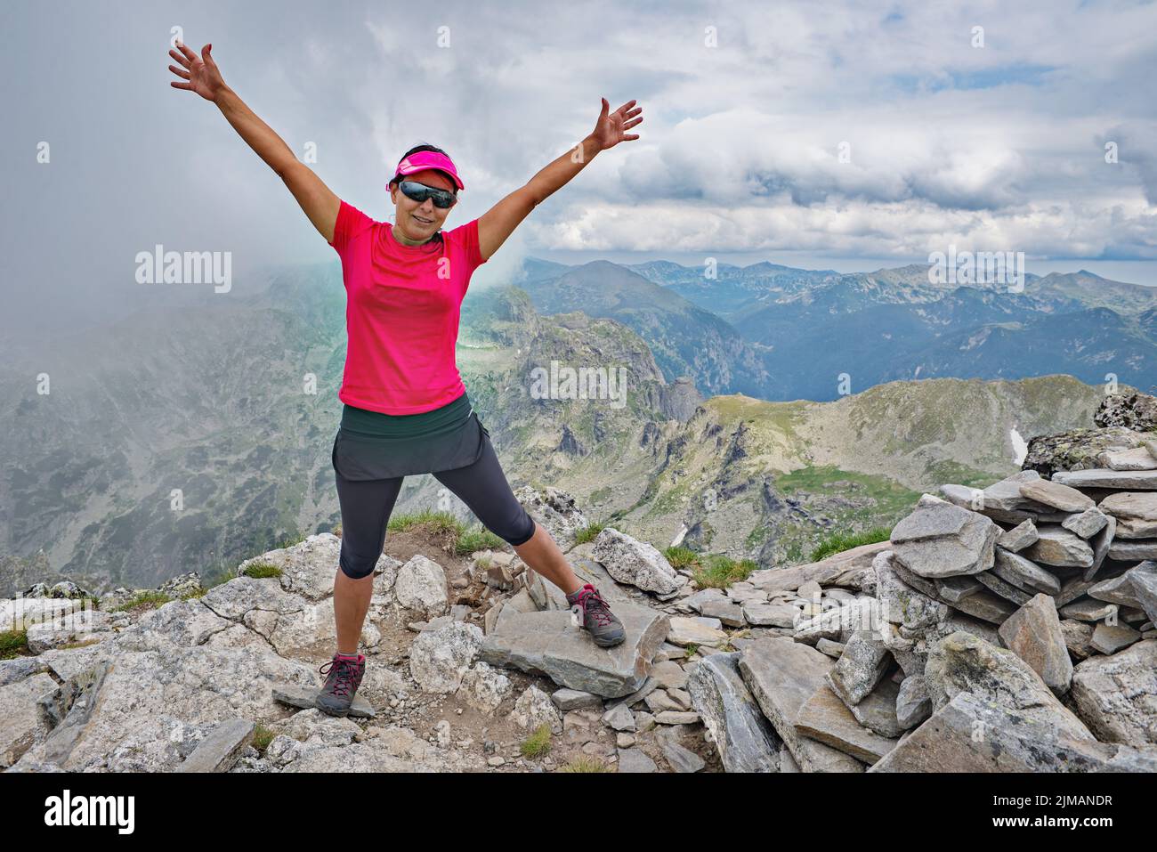 Female Mountain Peak Pose Stock Photo - Alamy