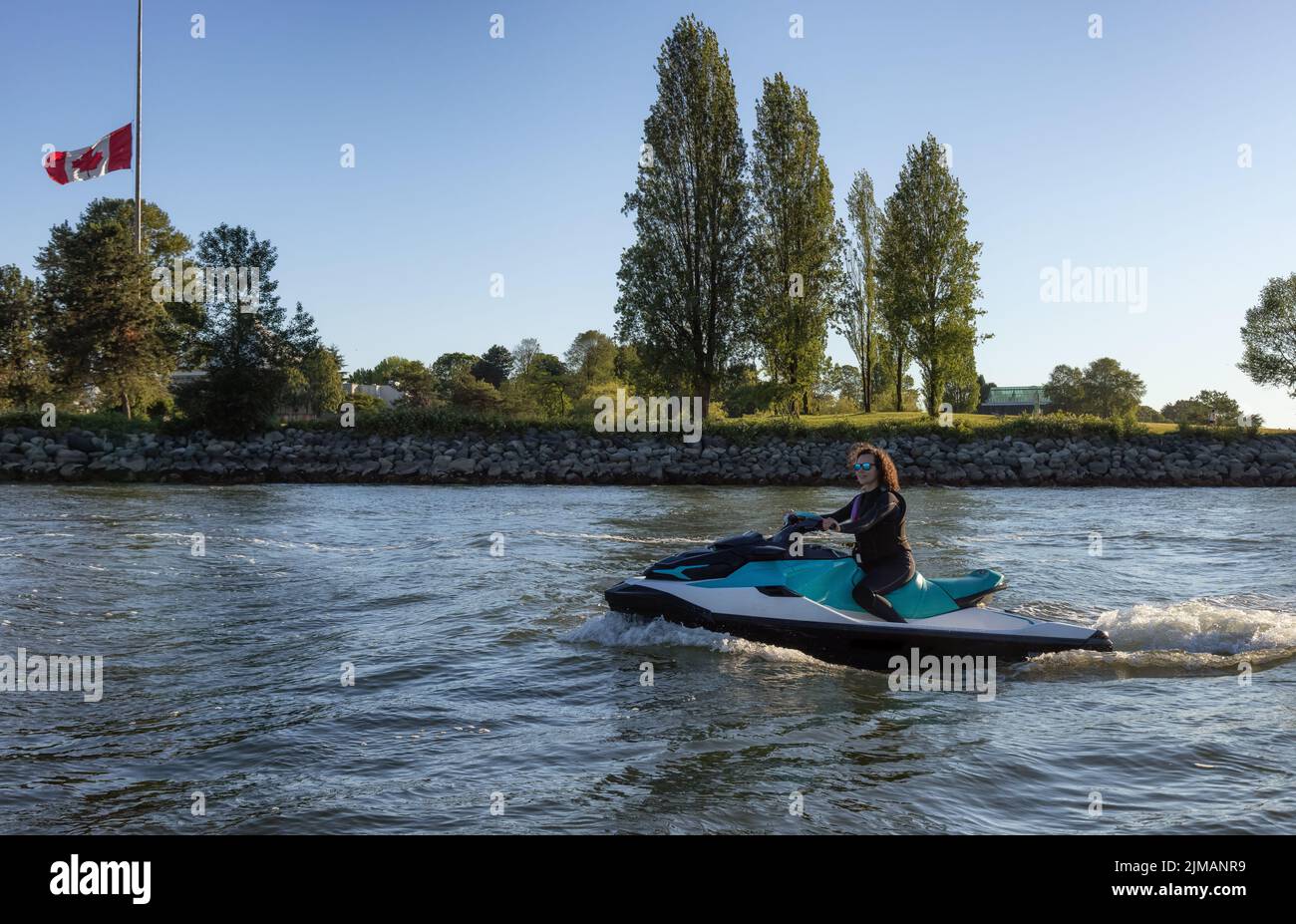 Adventurous Caucasian Woman on Water Scooter riding in the Ocean Stock ...