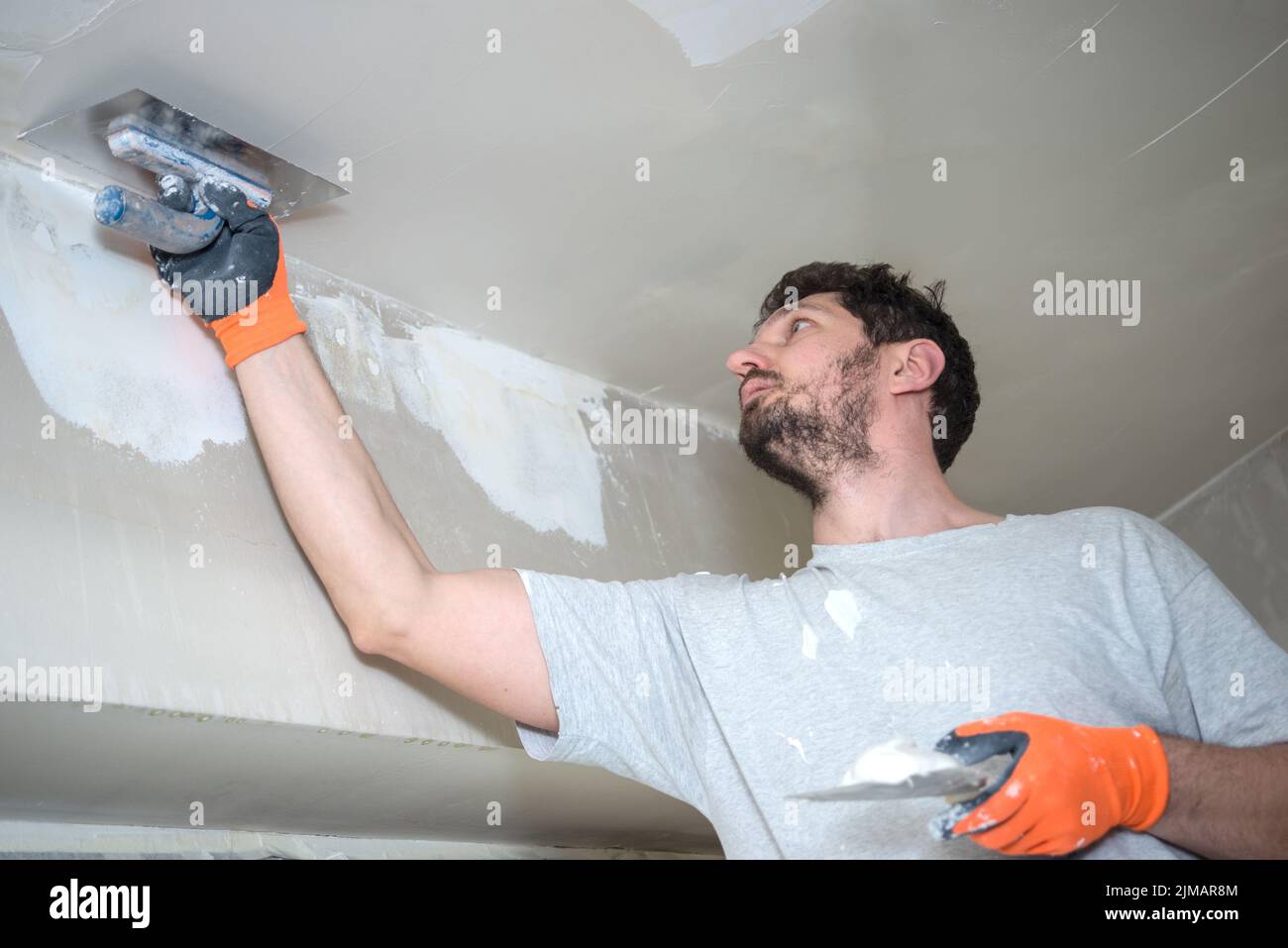 Worker Plastering Ceiling Stock Photo - Alamy