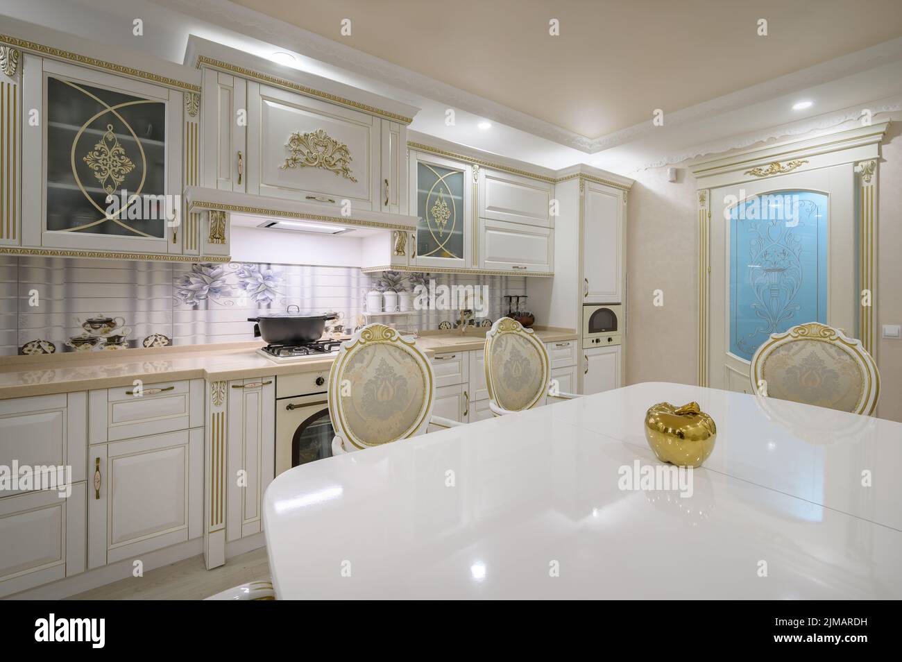 Renovated Interior of rich classic white kitchen Stock Photo - Alamy