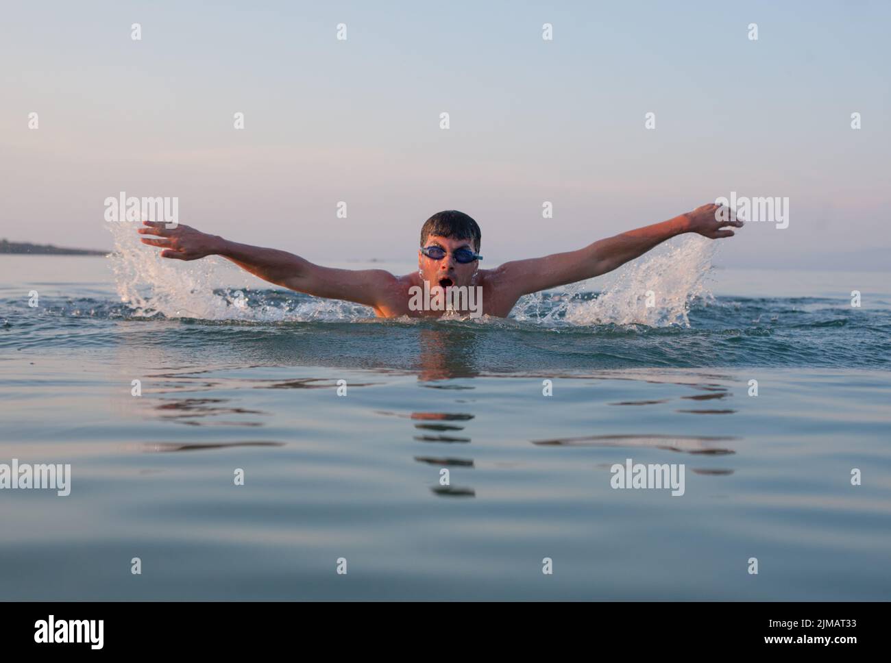 Man Swimming Sea Ocean Sunset Stock Photo - Alamy