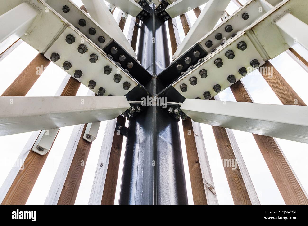 Massive steel beams end-to-end with bolts and nuts on the construction ...