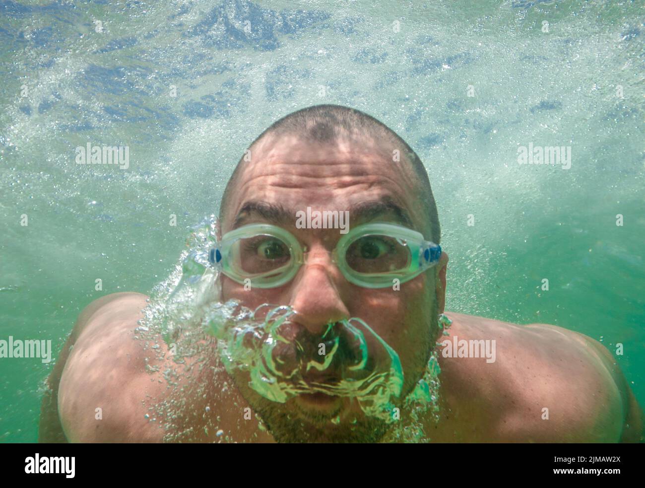 Funny Male Face Underwater Goggles Stock Photo - Alamy