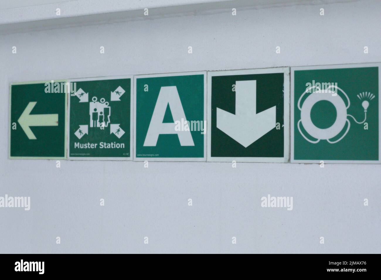 Muster station sign directing passengers to the life boats Stock Photo ...