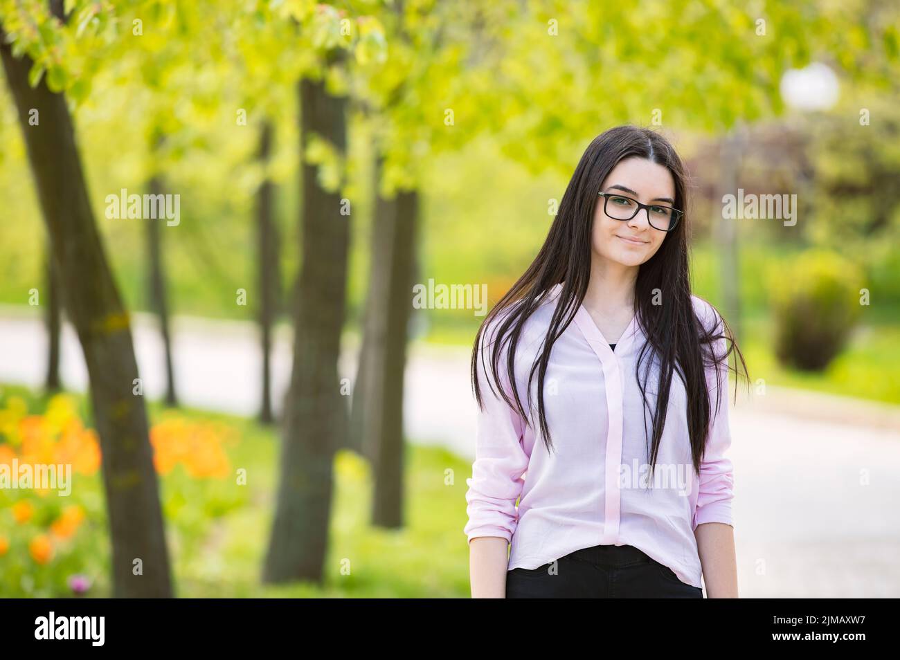 Girl looking back at camera hi-res stock photography and images - Alamy