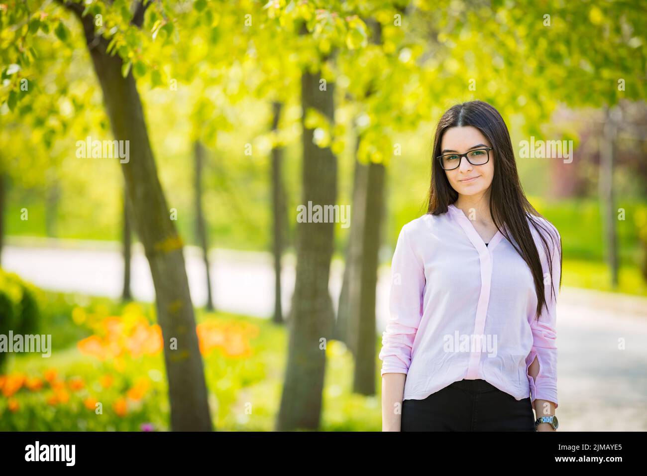 Girl looking back at camera hi-res stock photography and images - Alamy