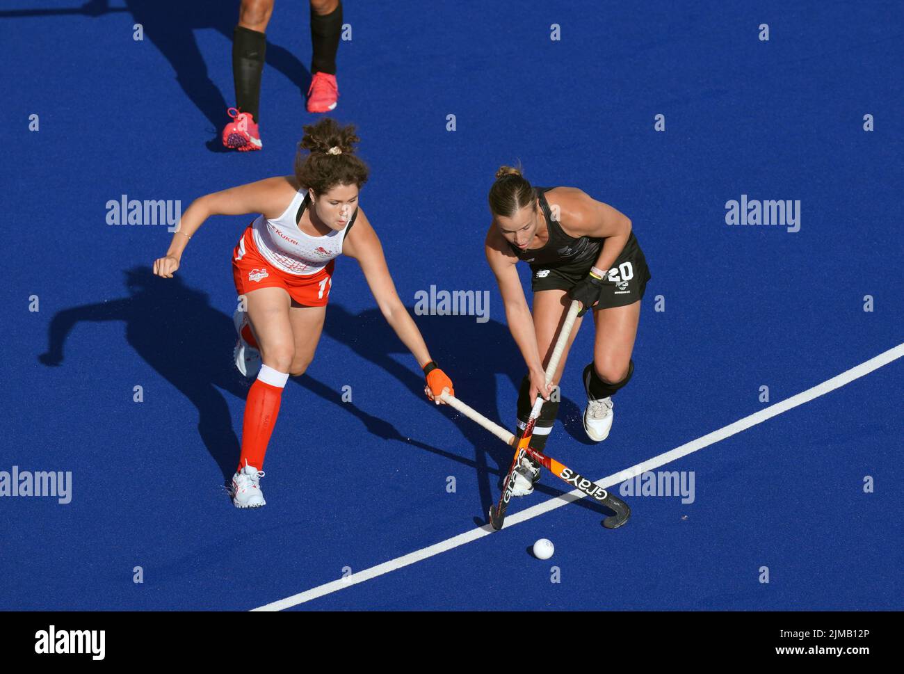 England's Holly Hunt (left) and New Zealand's' Megan Hull battle for ...