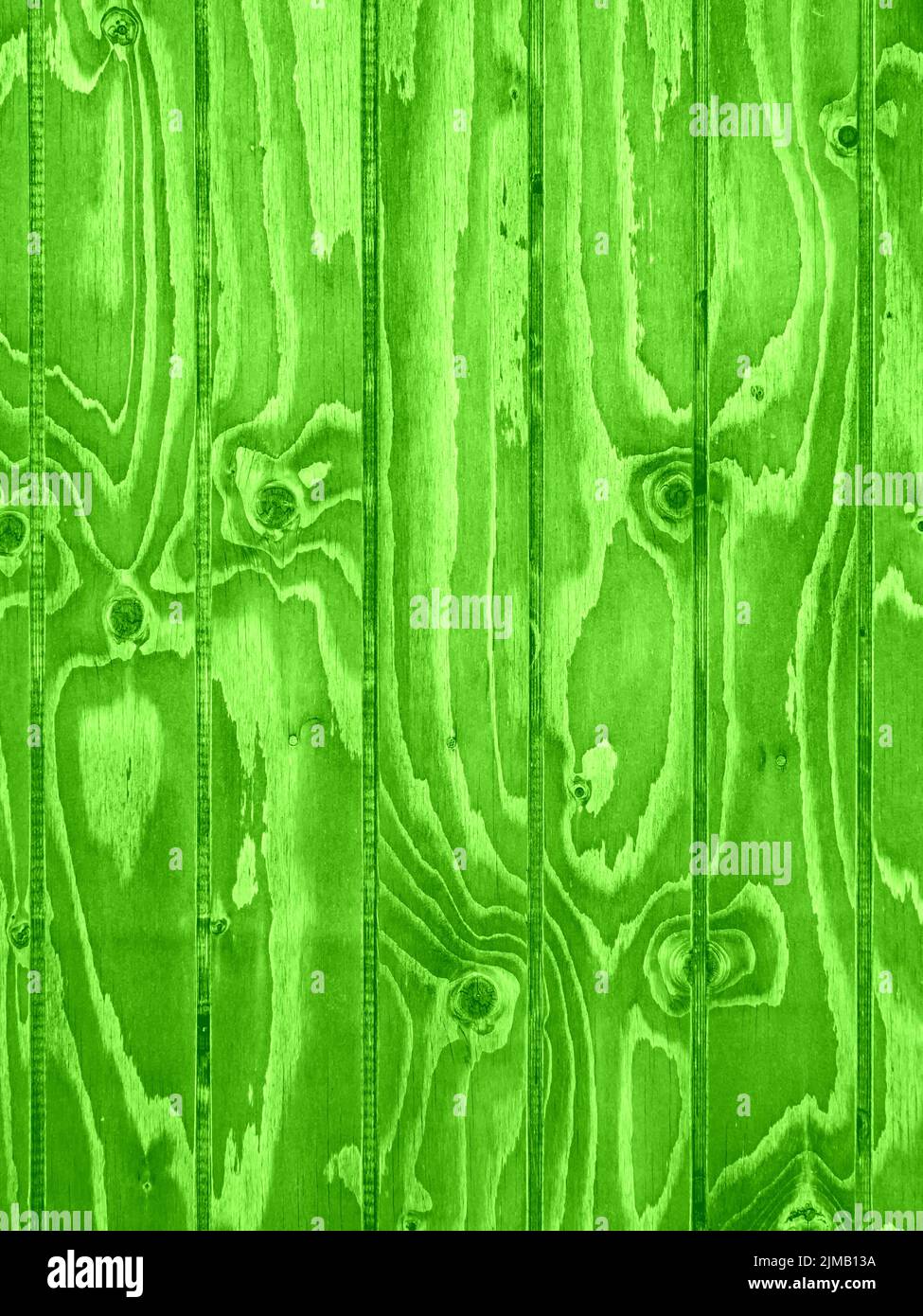 Vertically aligned green wooden boards with intense grain as background ...