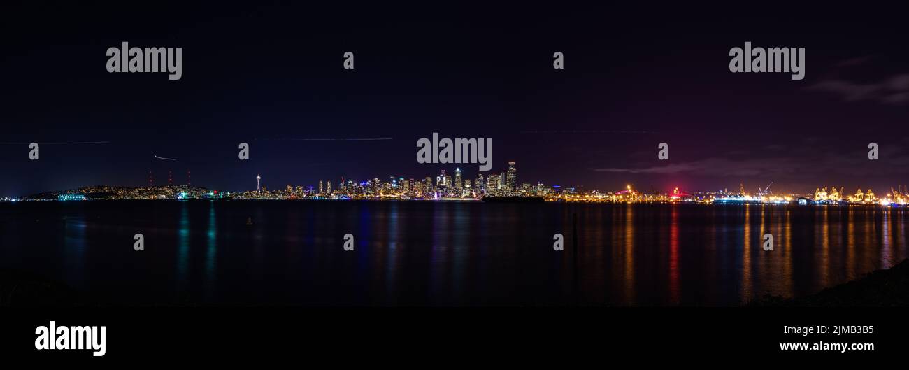 Night panoramic image of the Seattle skyline taken across the water on ...