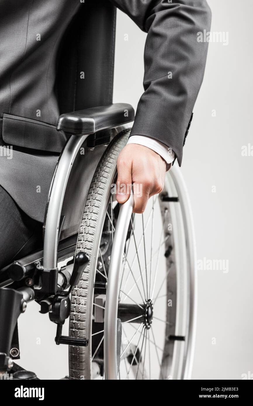 Invalid or disabled businessman in black suit sitting wheelchair Stock ...